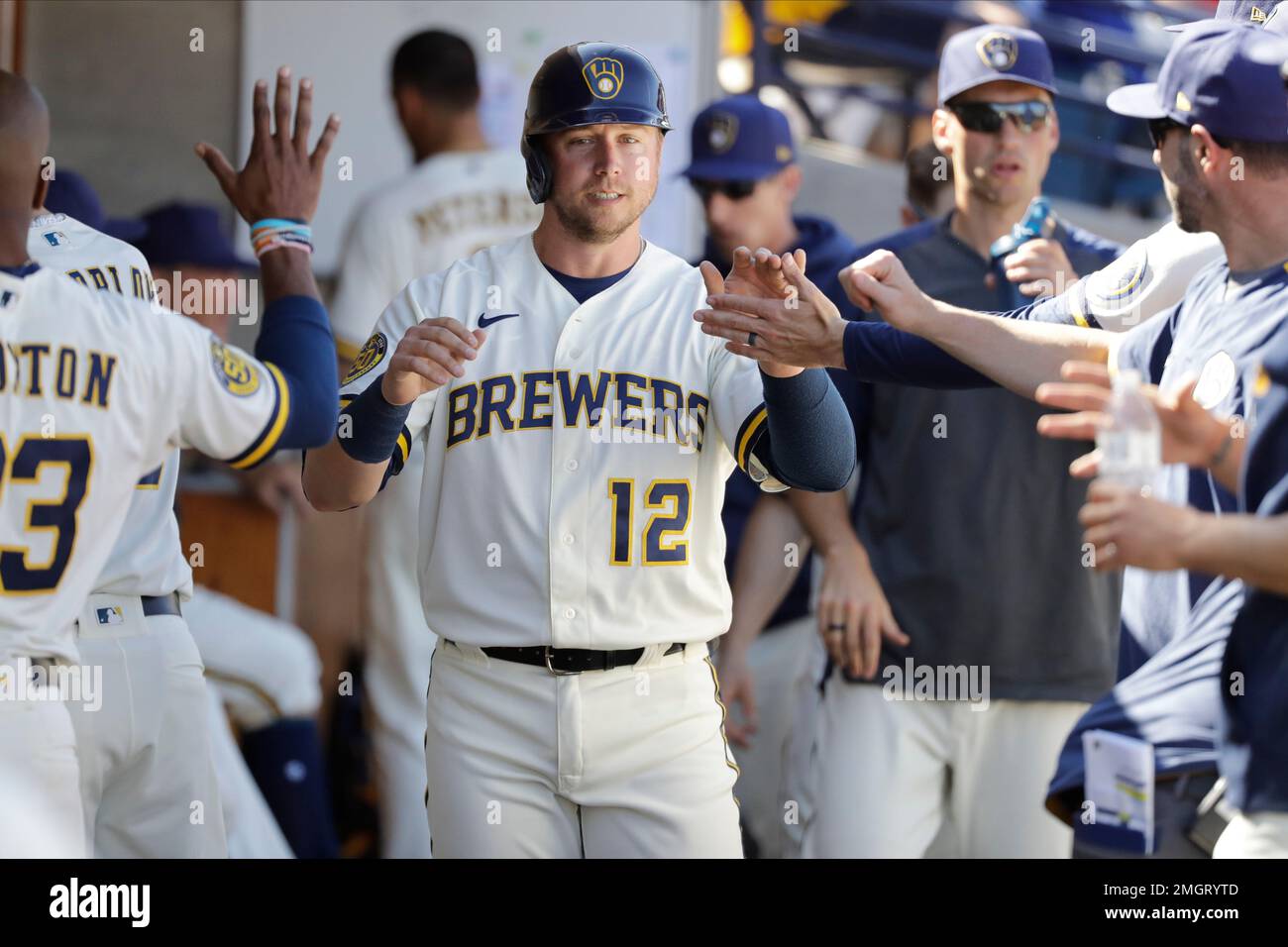 Milwaukee Brewers' Justin Smoak celebrates after scoring during a ...