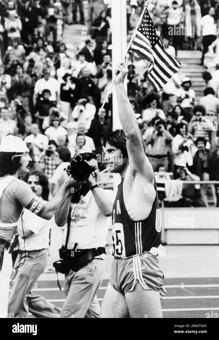 Decathlon gold medalist Bruce Jenner waves the U.S. flag acknowledging ...