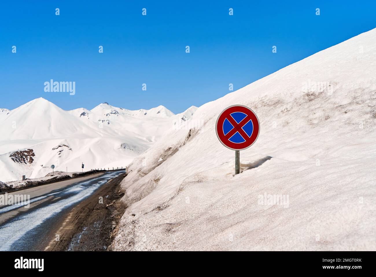 The road sign was almost completely covered with snow. Heavy snowfall ...