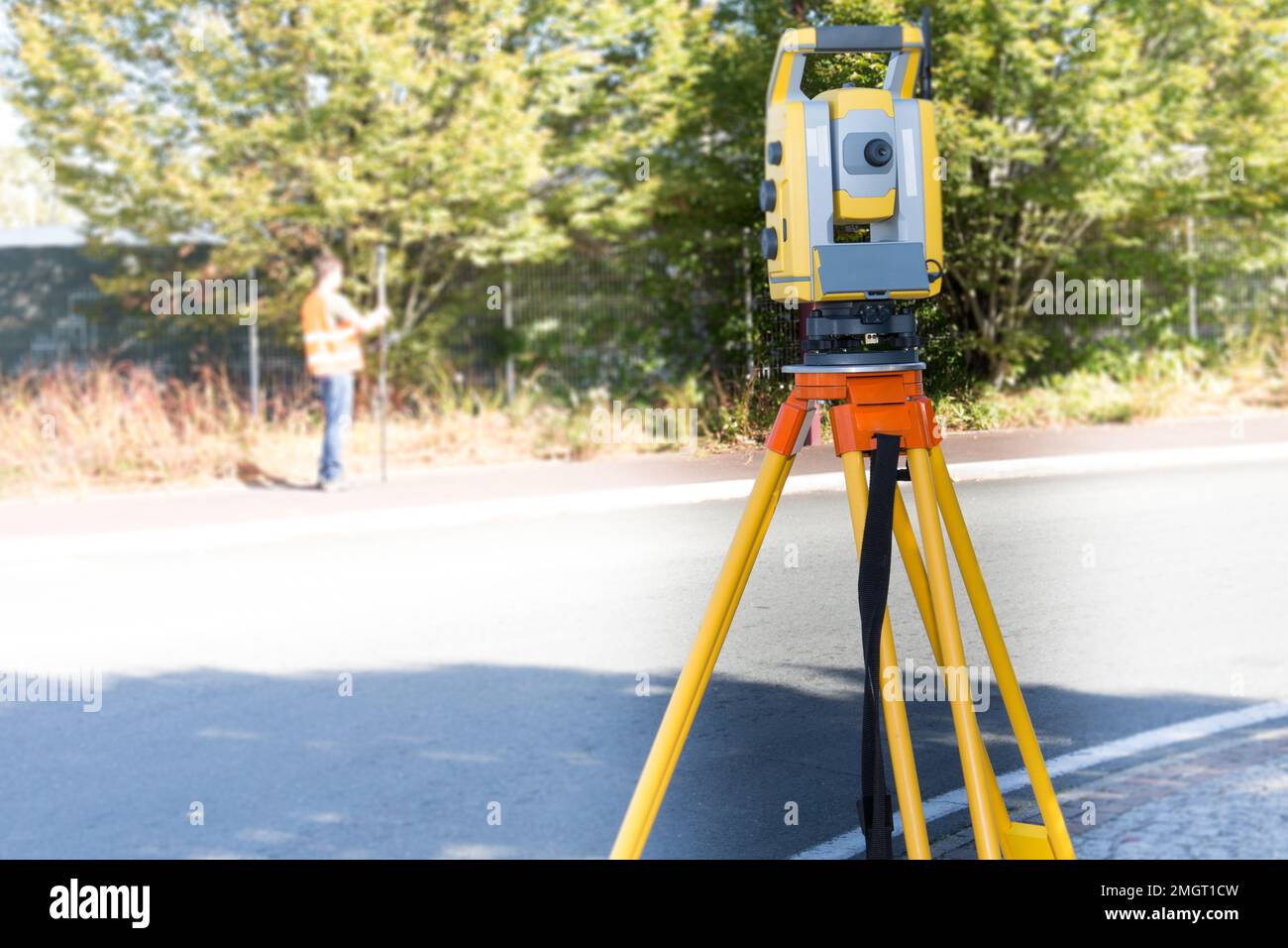 Civil Engineers At Construction Site using an altometer Surveyor ...