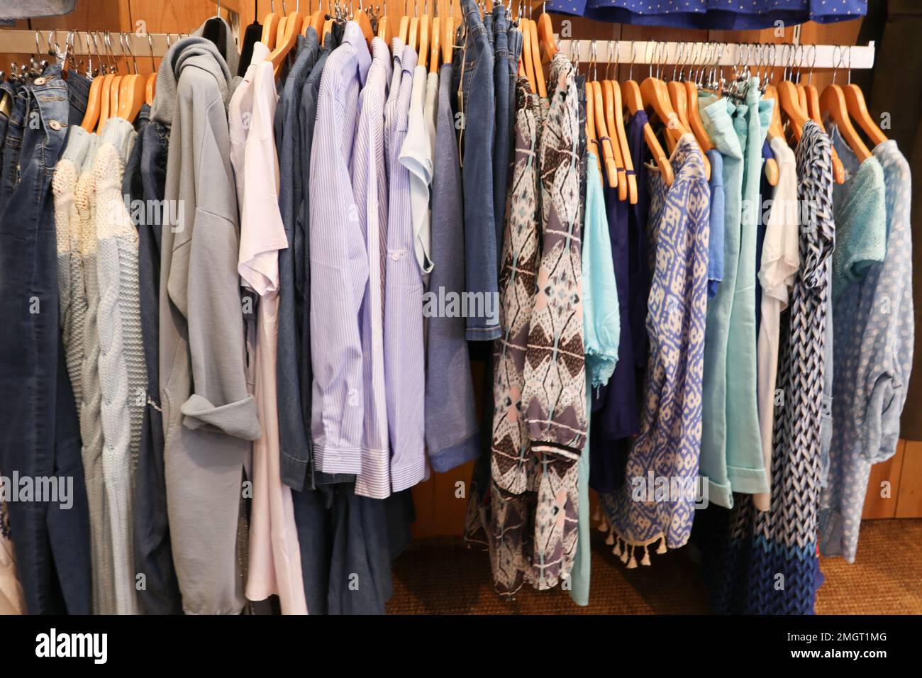 Women's clothing hanging hi-res stock photography and images - Alamy