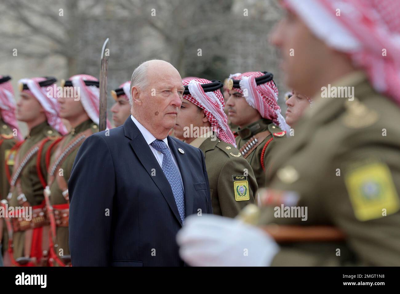 Norway's King Harold, reviews a guard of honor at the Husayniyah Palace ...