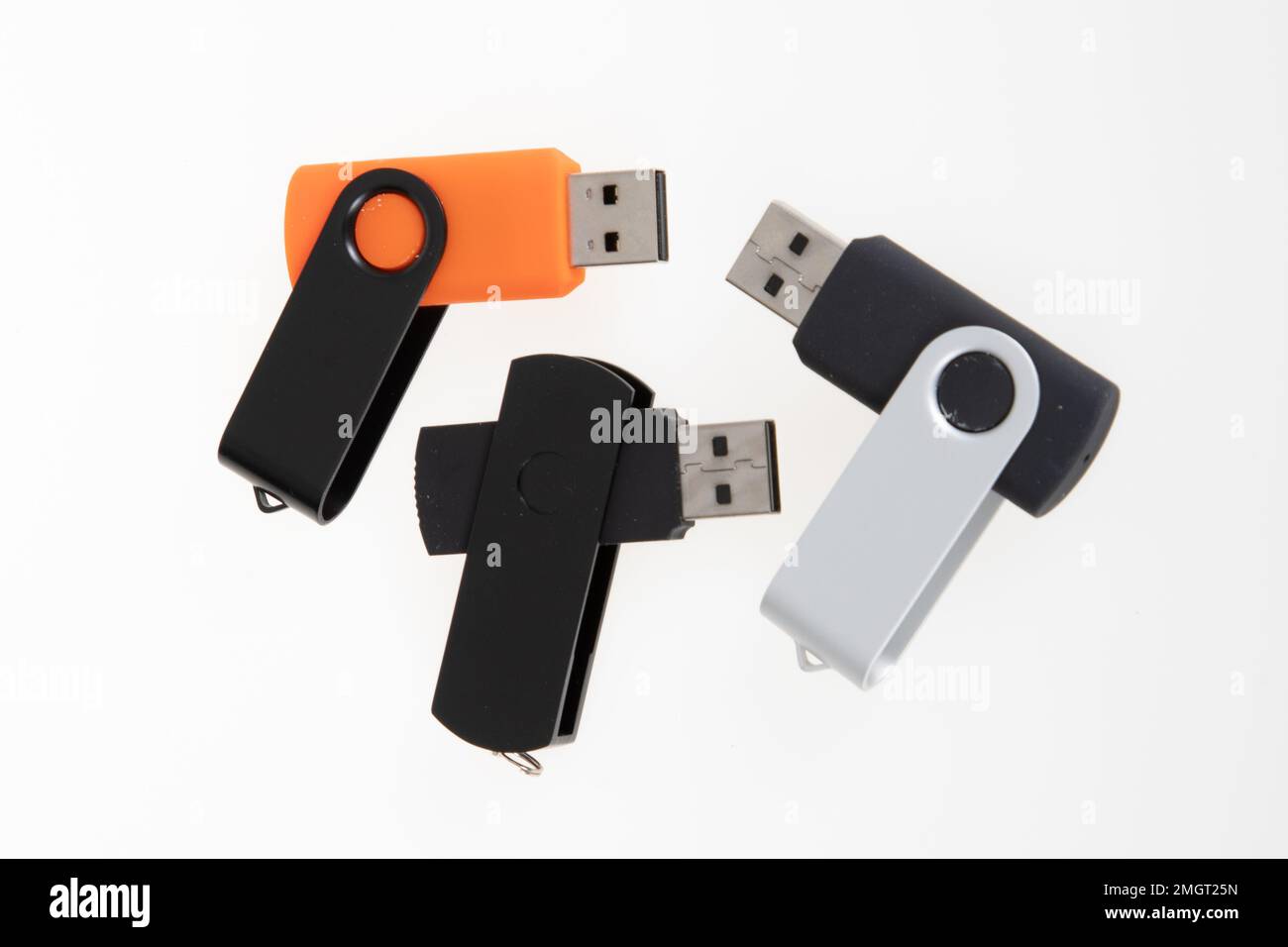 USB flash drive three keys in silver black and orange color Stock Photo ...