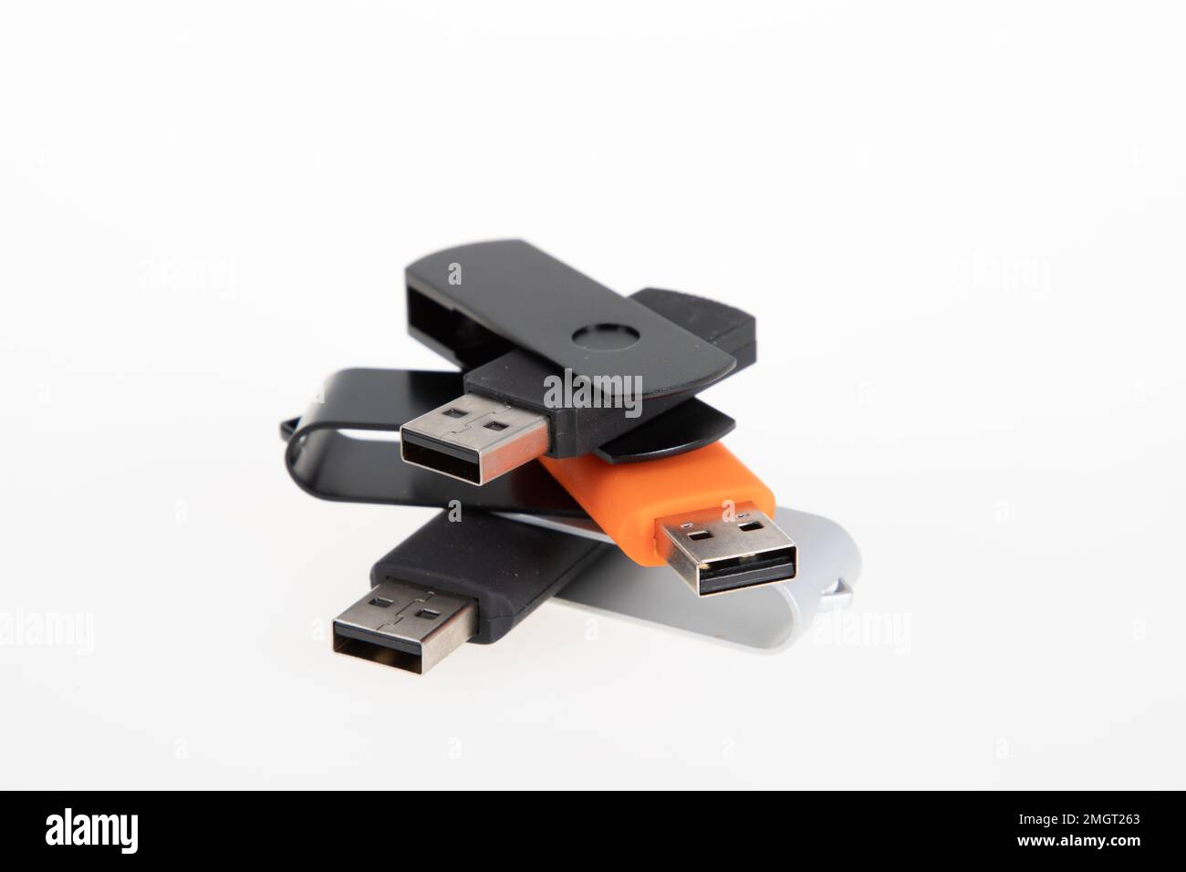 USB flash drive different usb keys stacked in placed pyramid on white ...