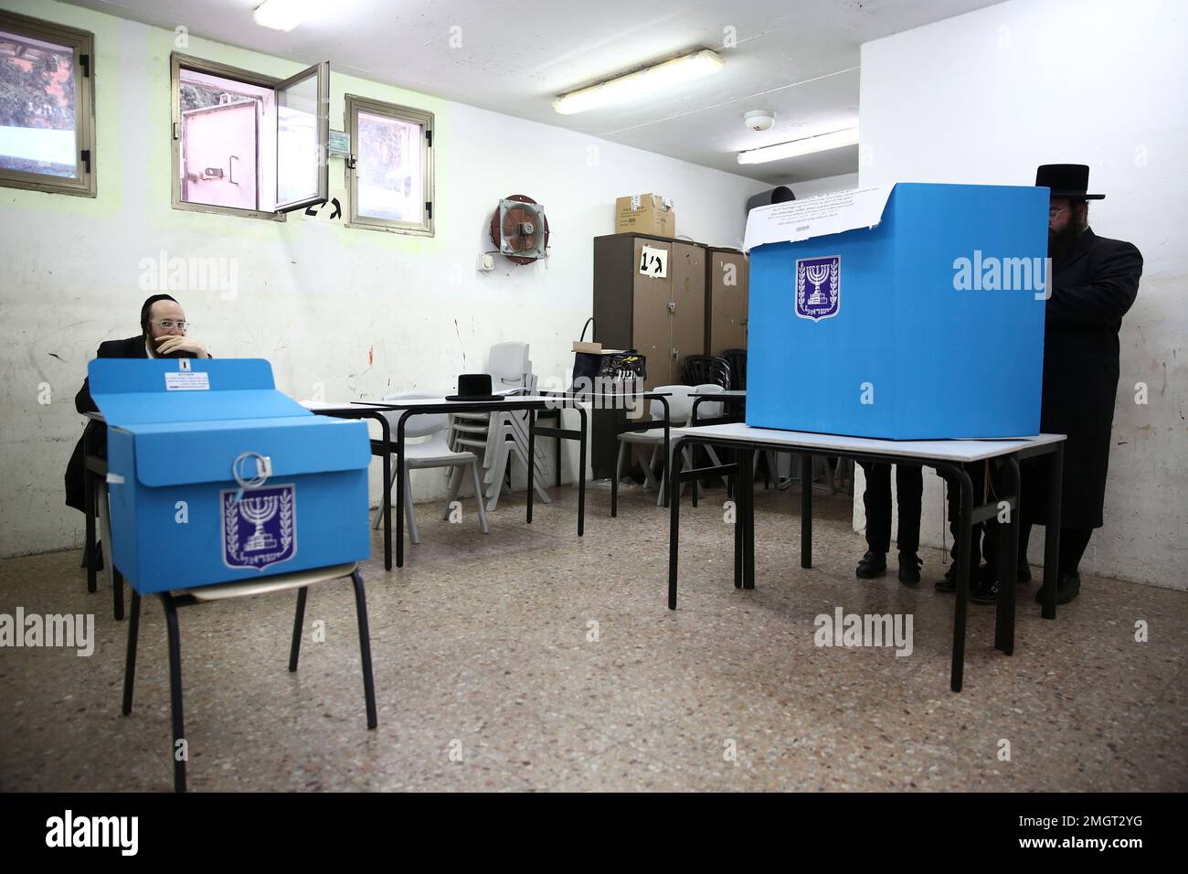 Ultra-orthodox man votes during elections in Bnei Brak, Israel, Monday ...