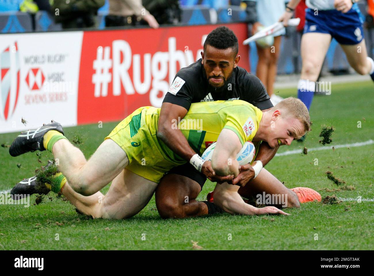Australia's Henry Hutchison, front, and New Zealand's Akuila Rokolisoa ...