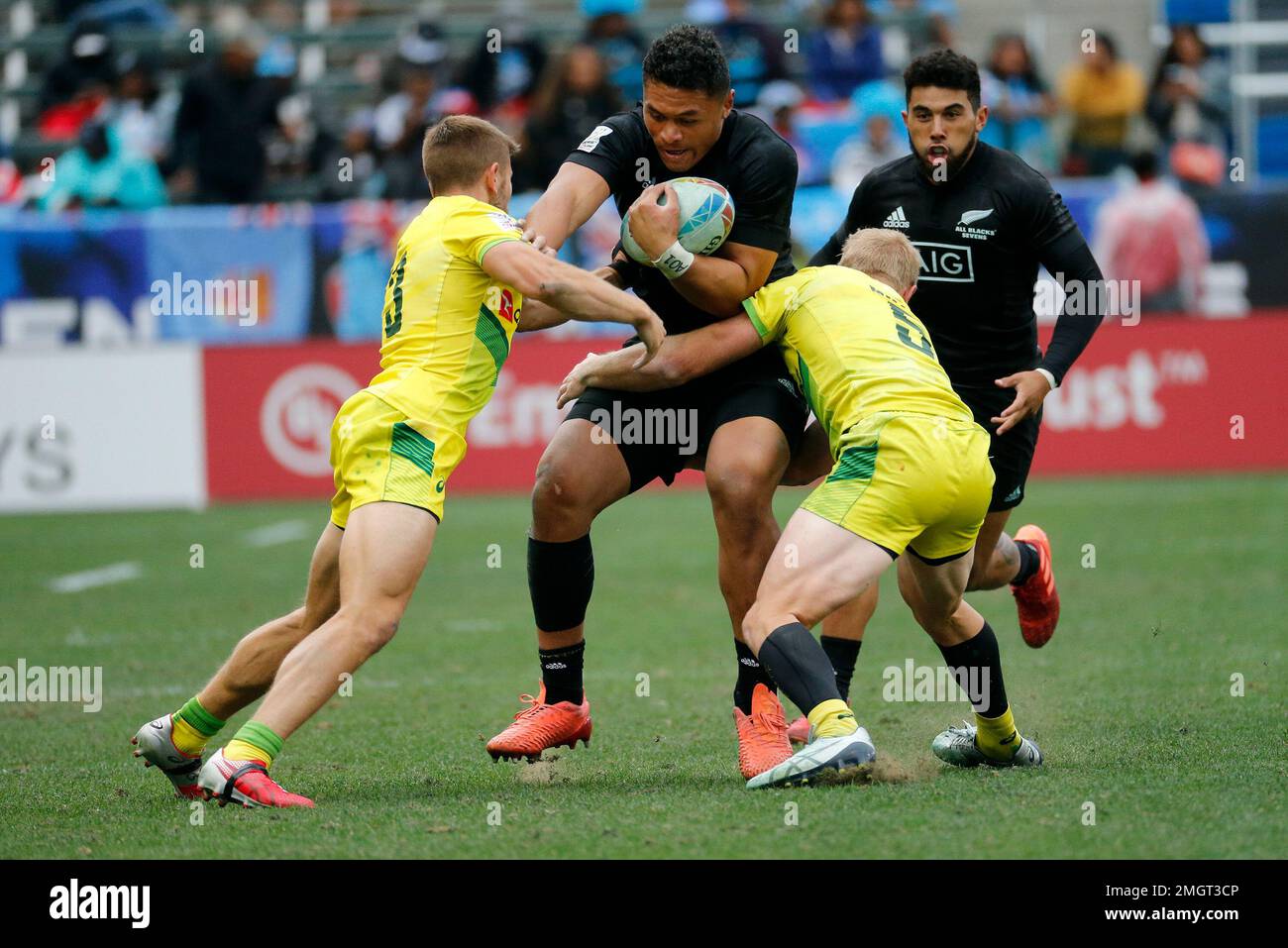 New Zealand's Calab Clarke, center, runs with the ball against ...