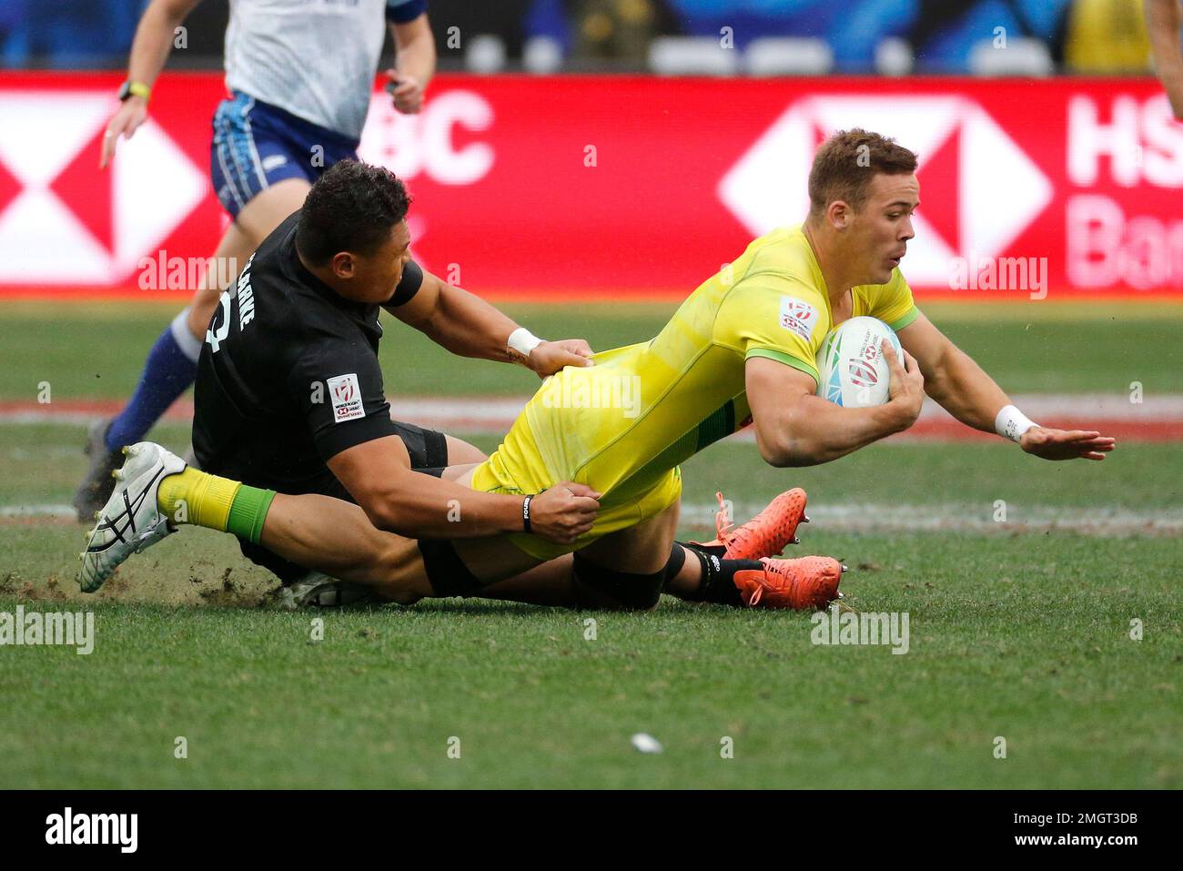 Australia's Joe Pincus, right, is tackled by New Zealand's Calab Clarke ...