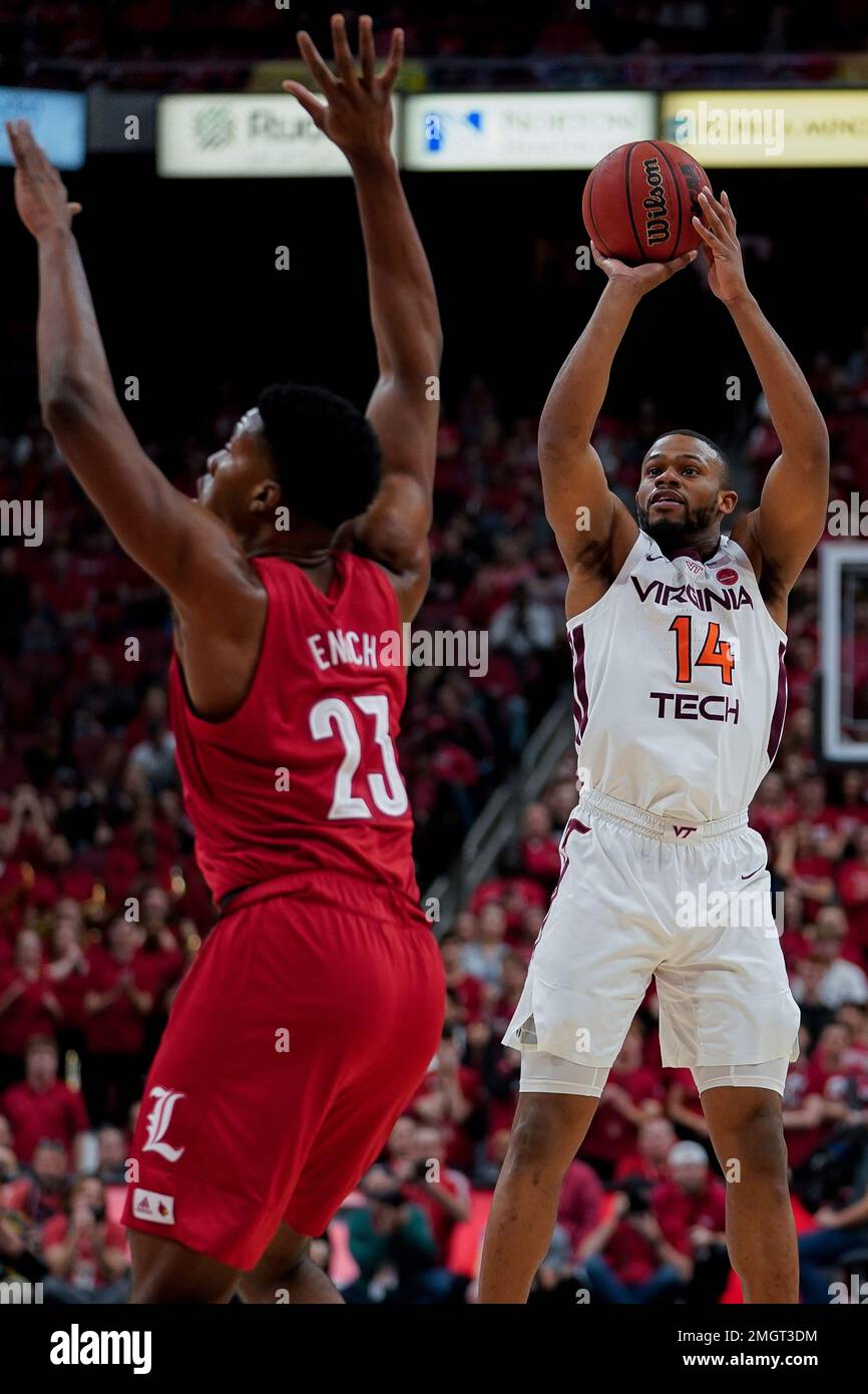 Virginia Tech forward P.J. Horne (14) shoots over Louisville center ...