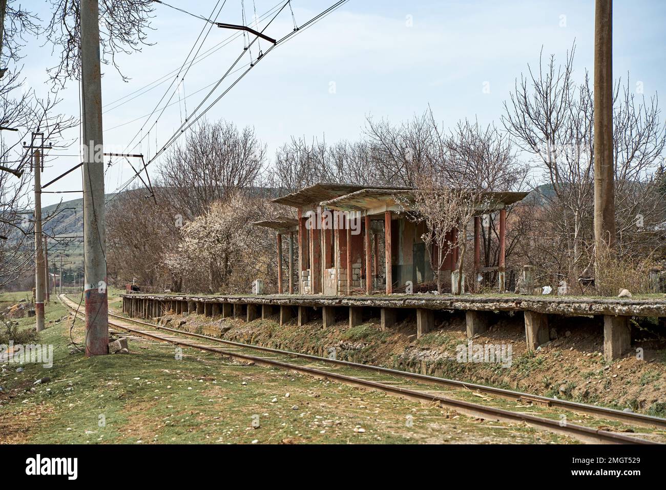 An old railroad pier with a small building in the village Stock Photo ...