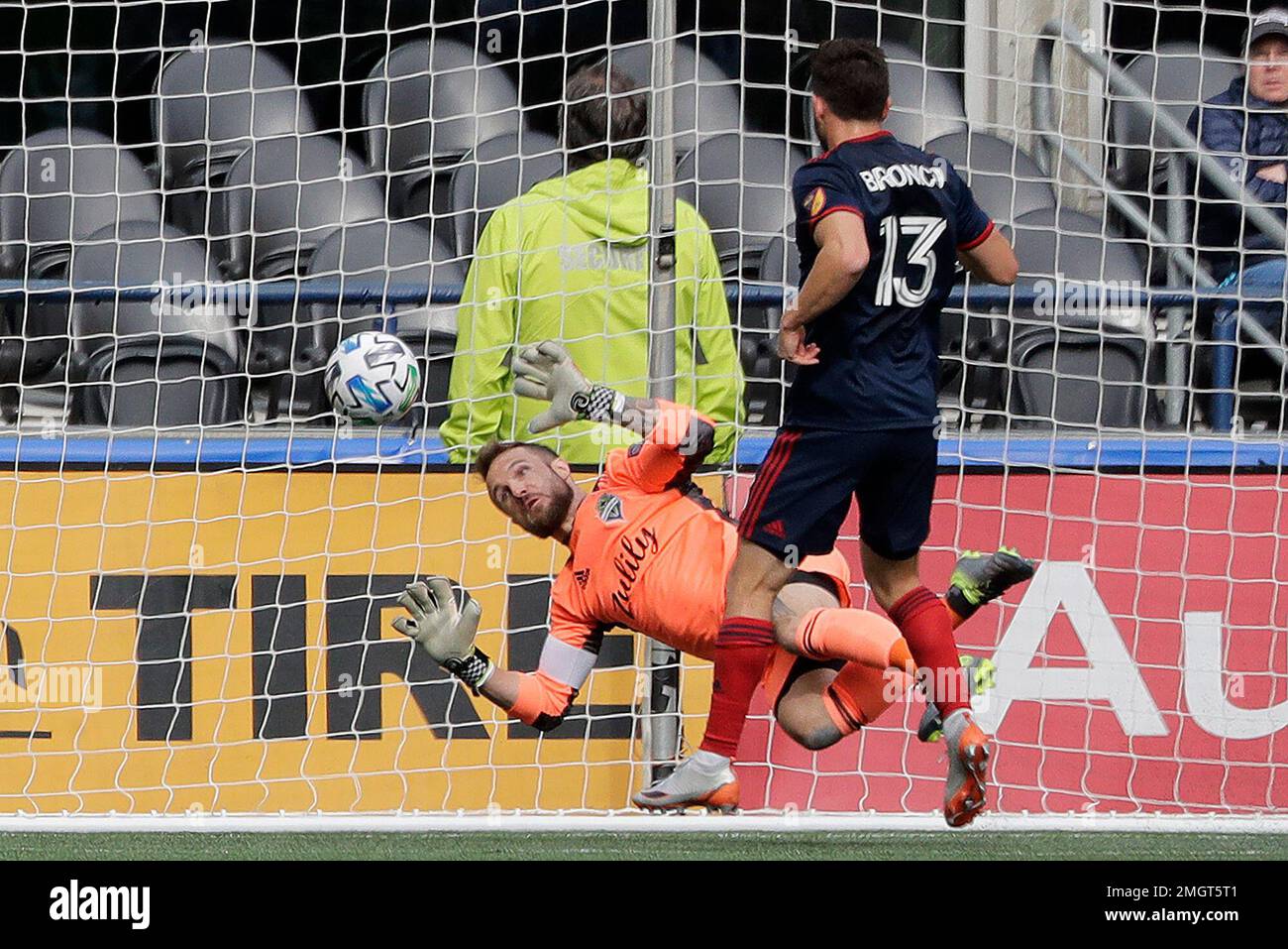 Seattle Sounders goalkeeper Stefan Frei dives to make a stop as Chicago ...