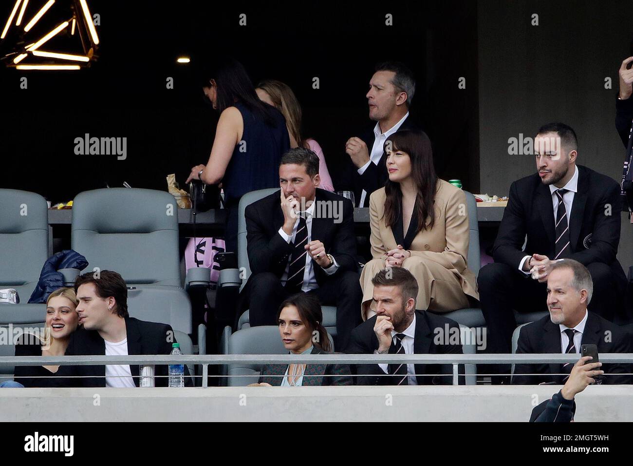 David Beckham, bottom right, watches an MLS soccer match between Los ...