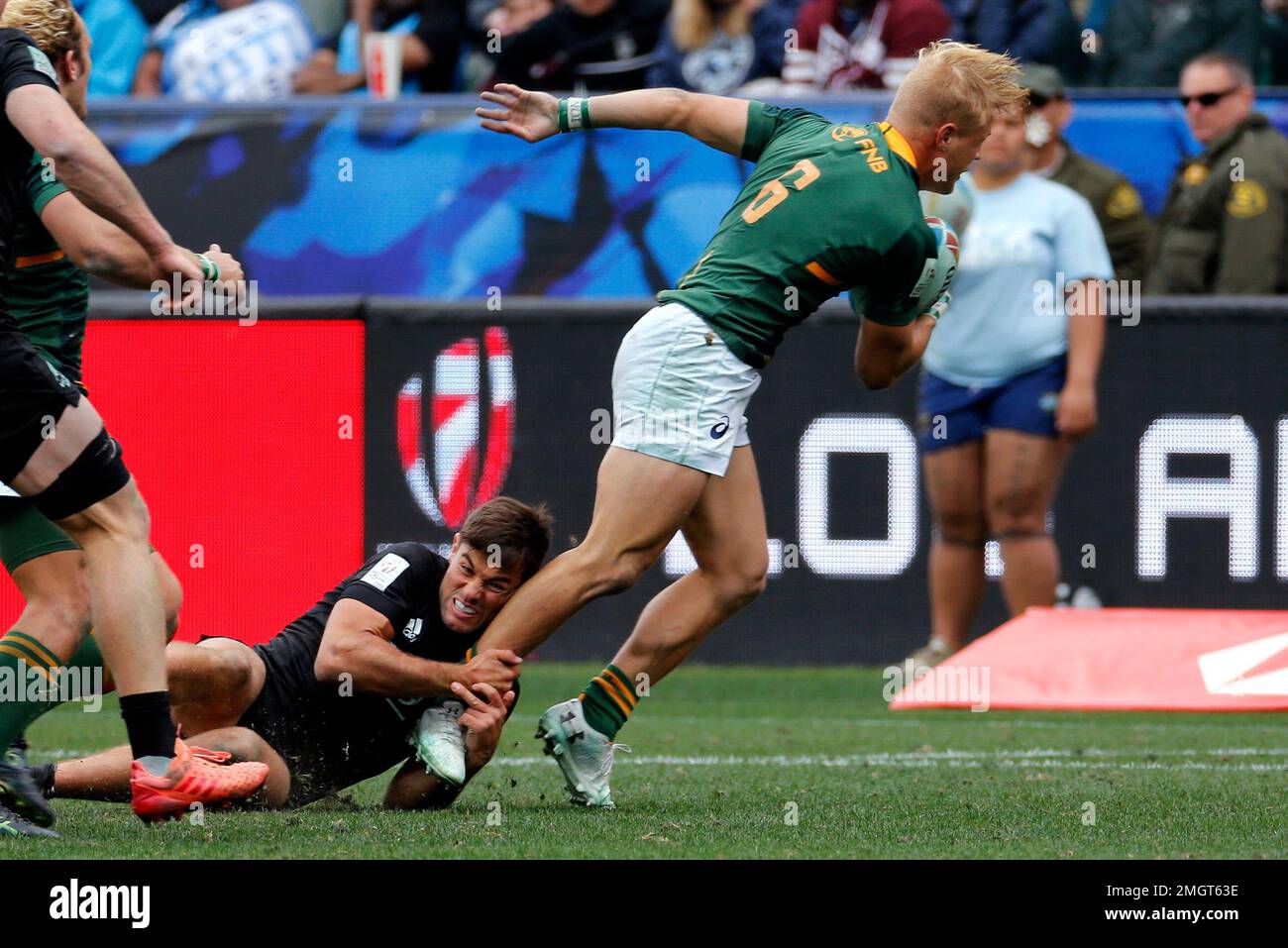 South Africa's JC Pretorius is tackled by New Zealand's Andrew ...