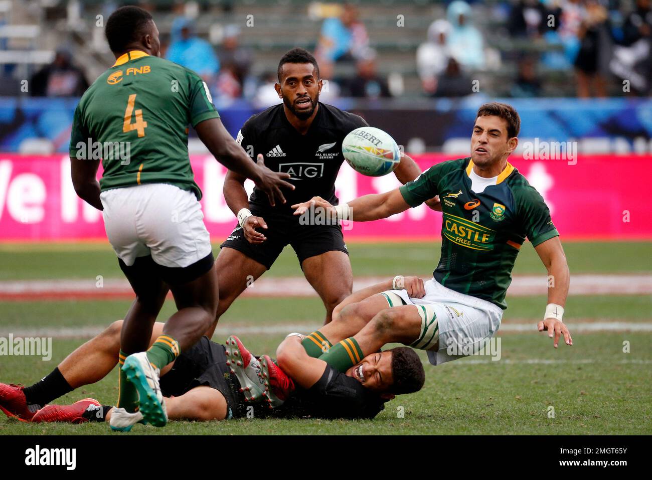 South Africa's Chris Dry, right, passes the ball to teammate Sakoyisa ...
