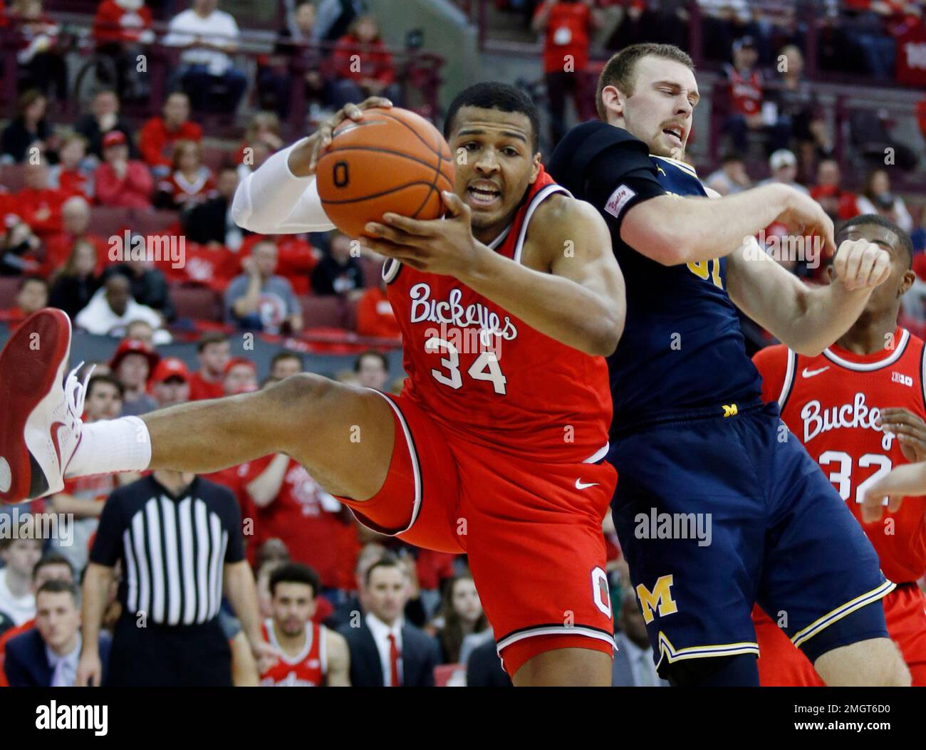 Ohio State forward Kaleb Wesson, left, grabs a rebound against Michigan ...