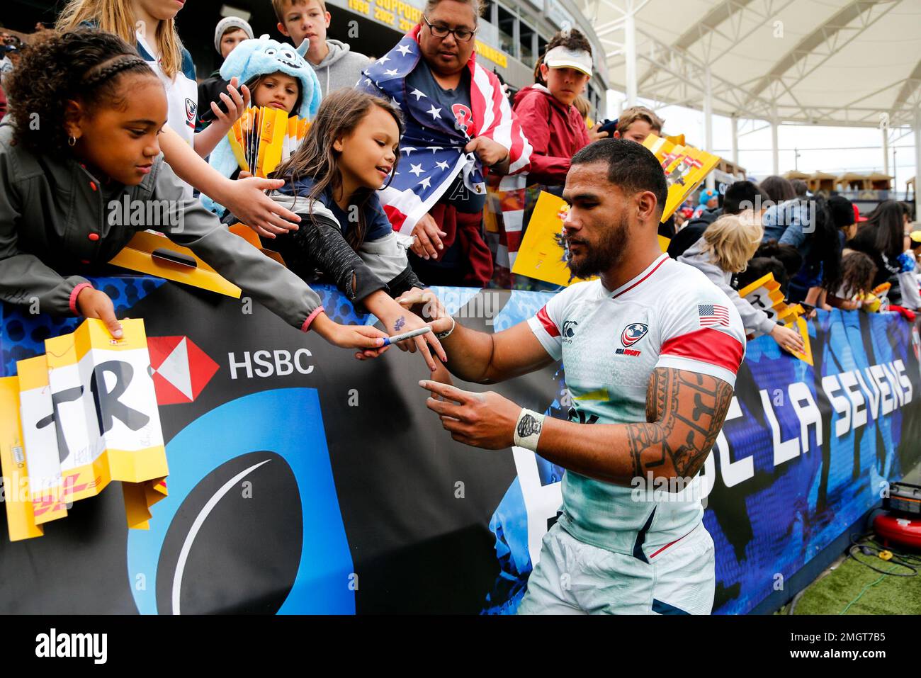 United States' Martin Iosefo signs autography for fans during the Los ...