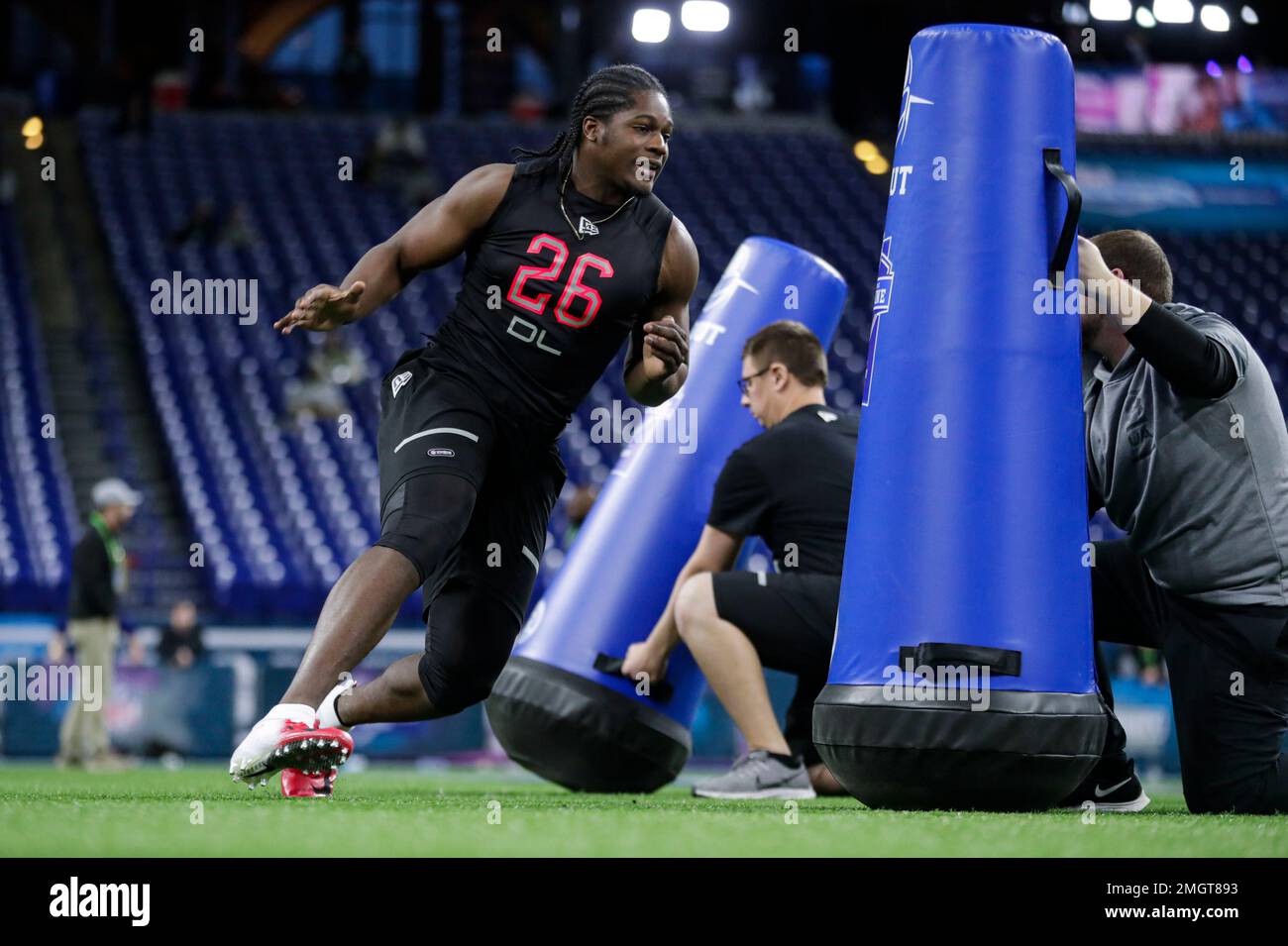 Miami defensive lineman Jonathan Garvin runs a drill at the NFL ...