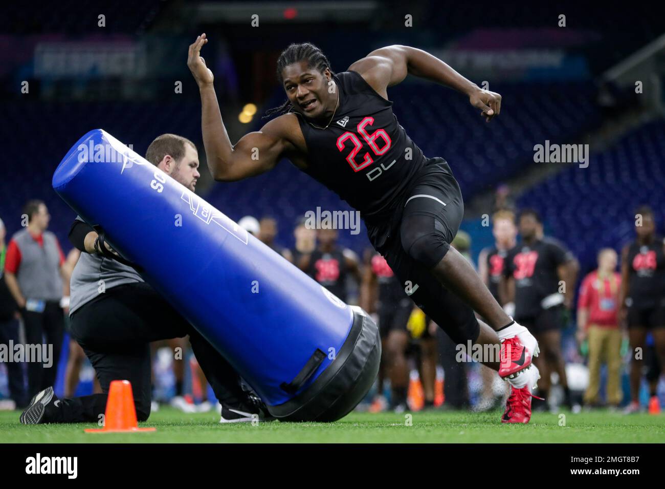Miami defensive lineman Jonathan Garvin runs a drill at the NFL ...