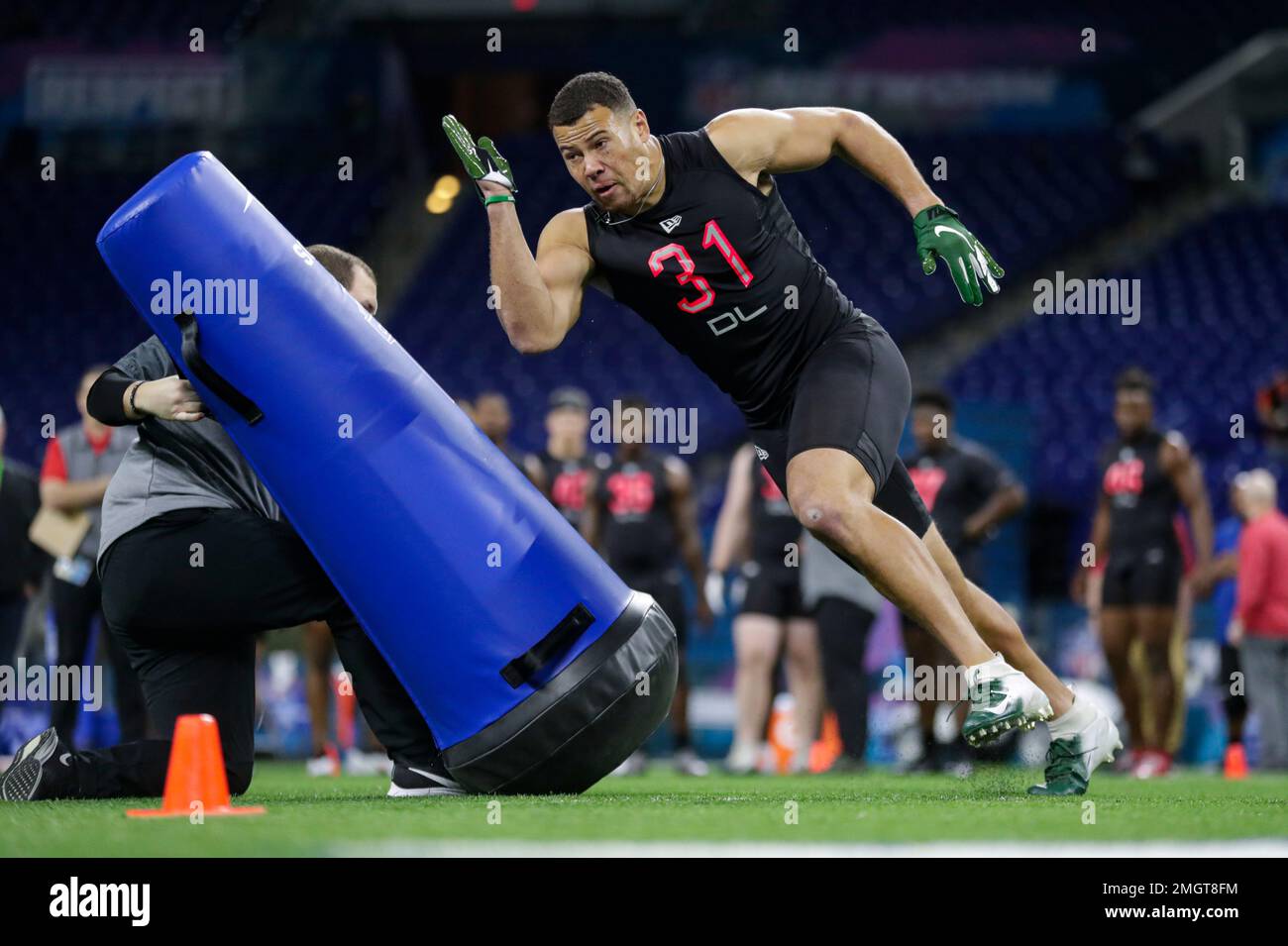 Charlotte defensive lineman Alex Highsmith runs a drill at the NFL ...