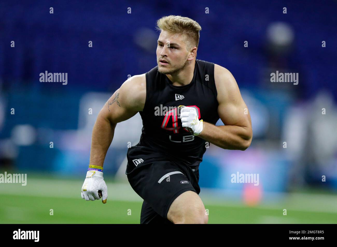 Wyoming linebacker Logan Wilson runs a drill at the NFL football ...
