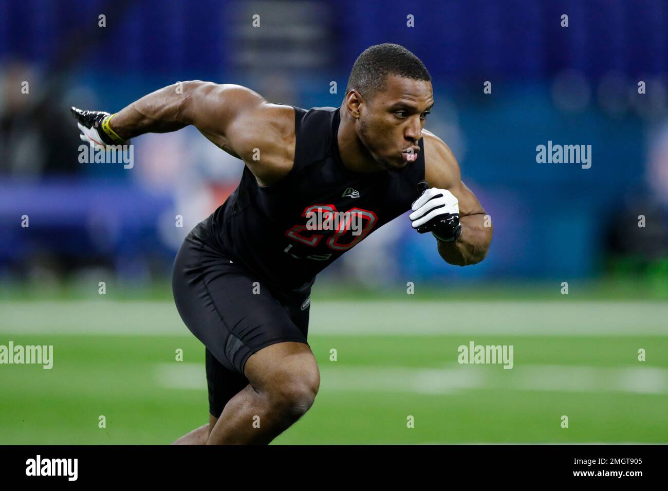 Michigan linebacker Khaleke Hudson runs a drill at the NFL football ...