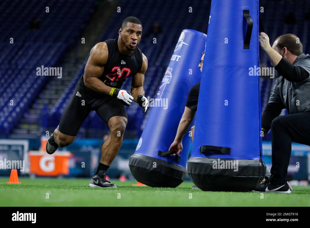 Michigan linebacker Khaleke Hudson runs a drill at the NFL football ...