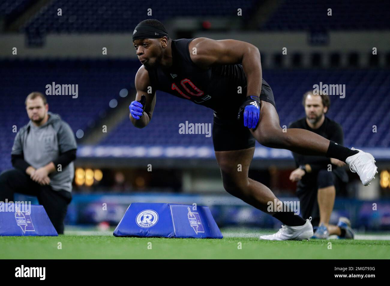 Auburn linebacker Nick Coe runs a drill at the NFL football scouting ...