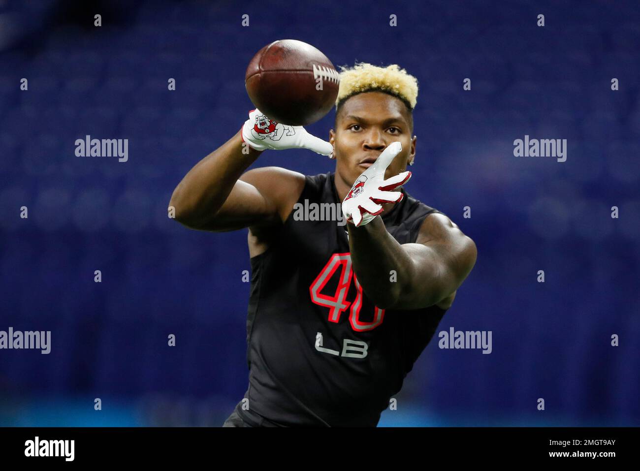 Fresno State linebacker Mykal Walker runs a drill at the NFL football ...