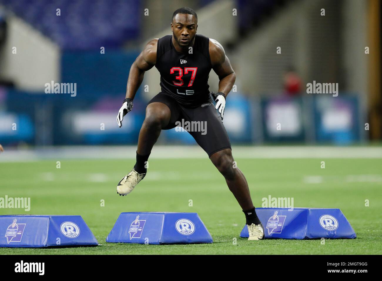 Colorado linebacker Davion Taylor runs a drill at the NFL football scouting combine in ...