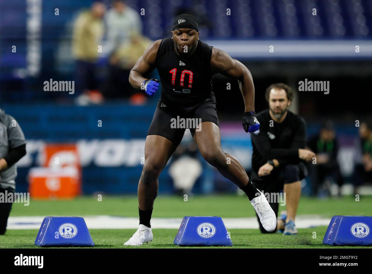 Auburn linebacker Nick Coe runs a drill at the NFL football scouting ...
