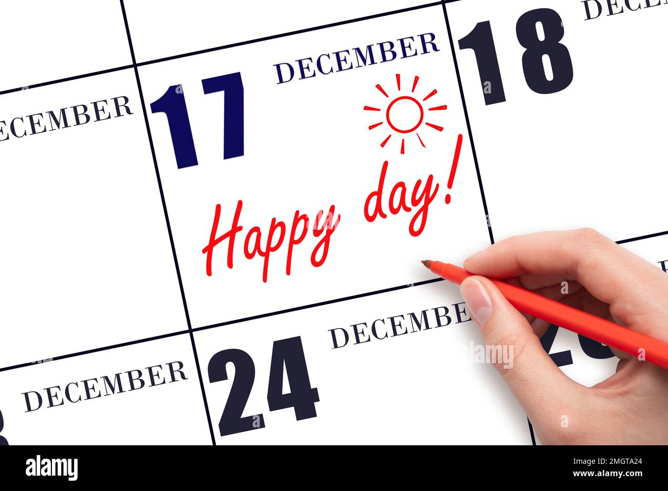 17th day of December. Hand writing the text HAPPY DAY and drawing the ...