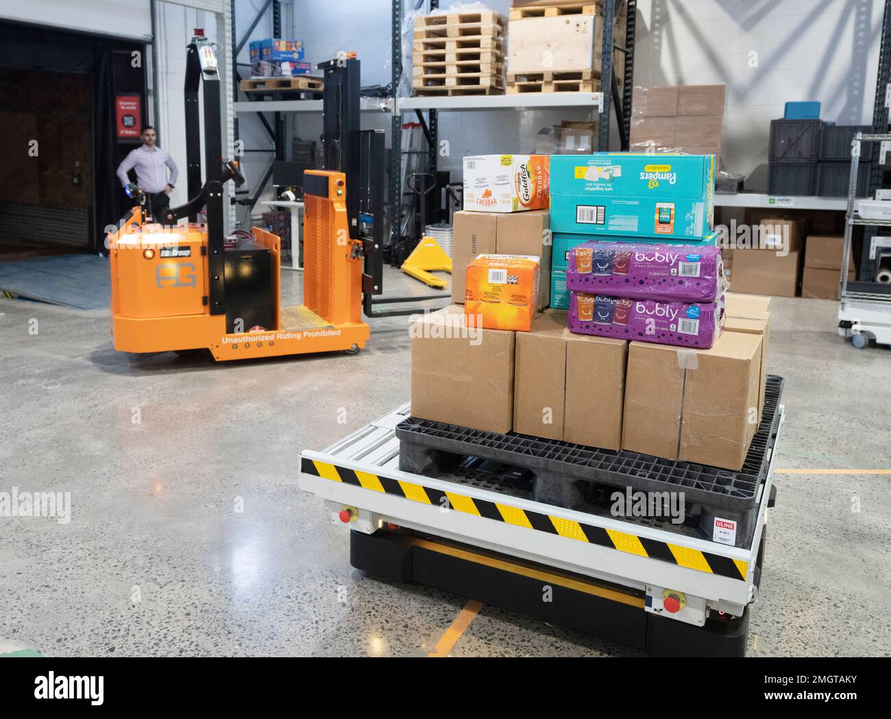 A robot forklift and package mover are seen at Deloitte Canada's Smart ...