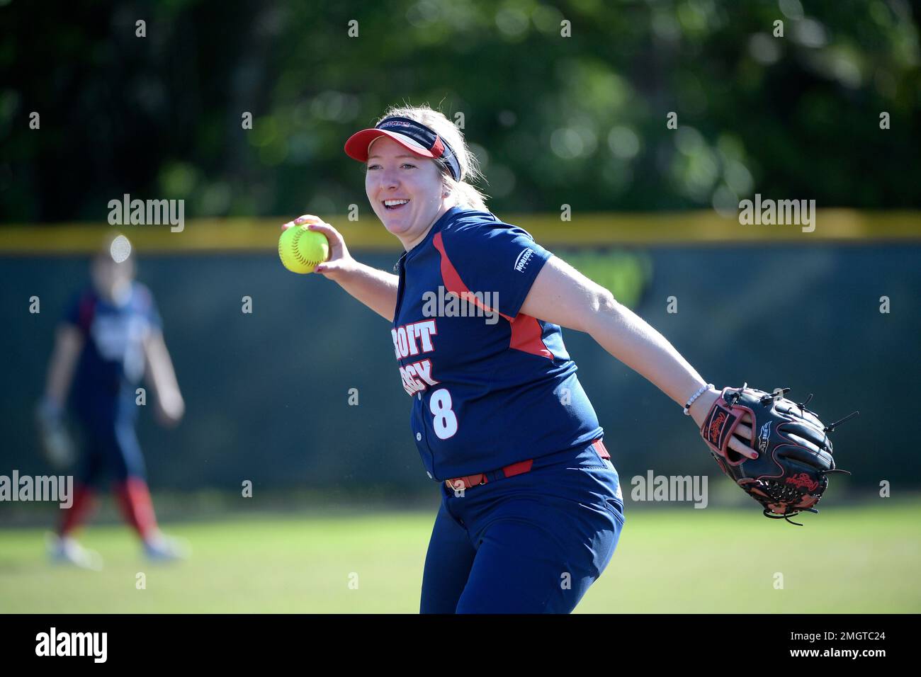 Detroit Mercy's Liz Murphy (8) warms up before an NCAA college softball ...