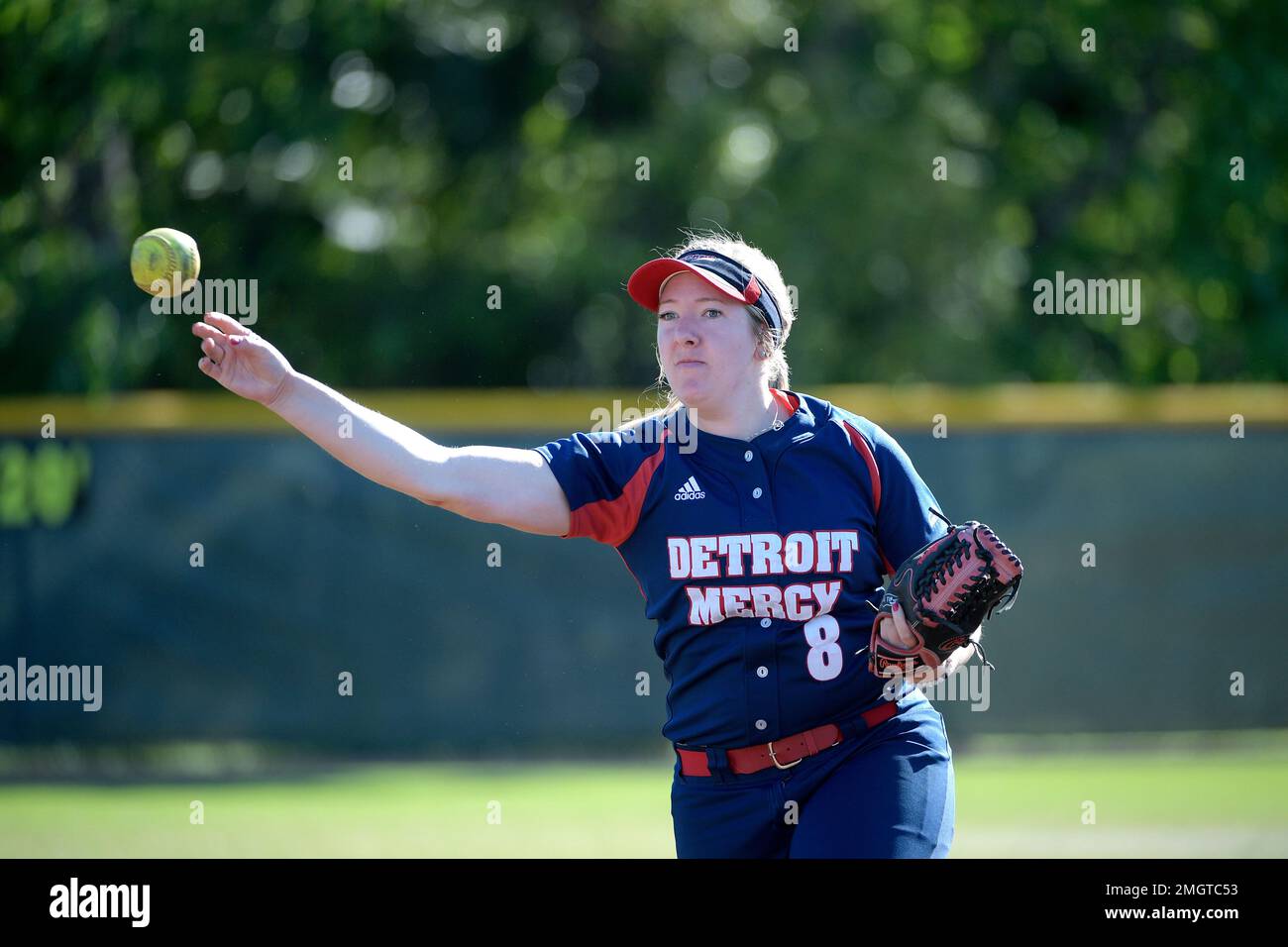 Detroit Mercy's Liz Murphy (8) warms up before an NCAA college softball ...