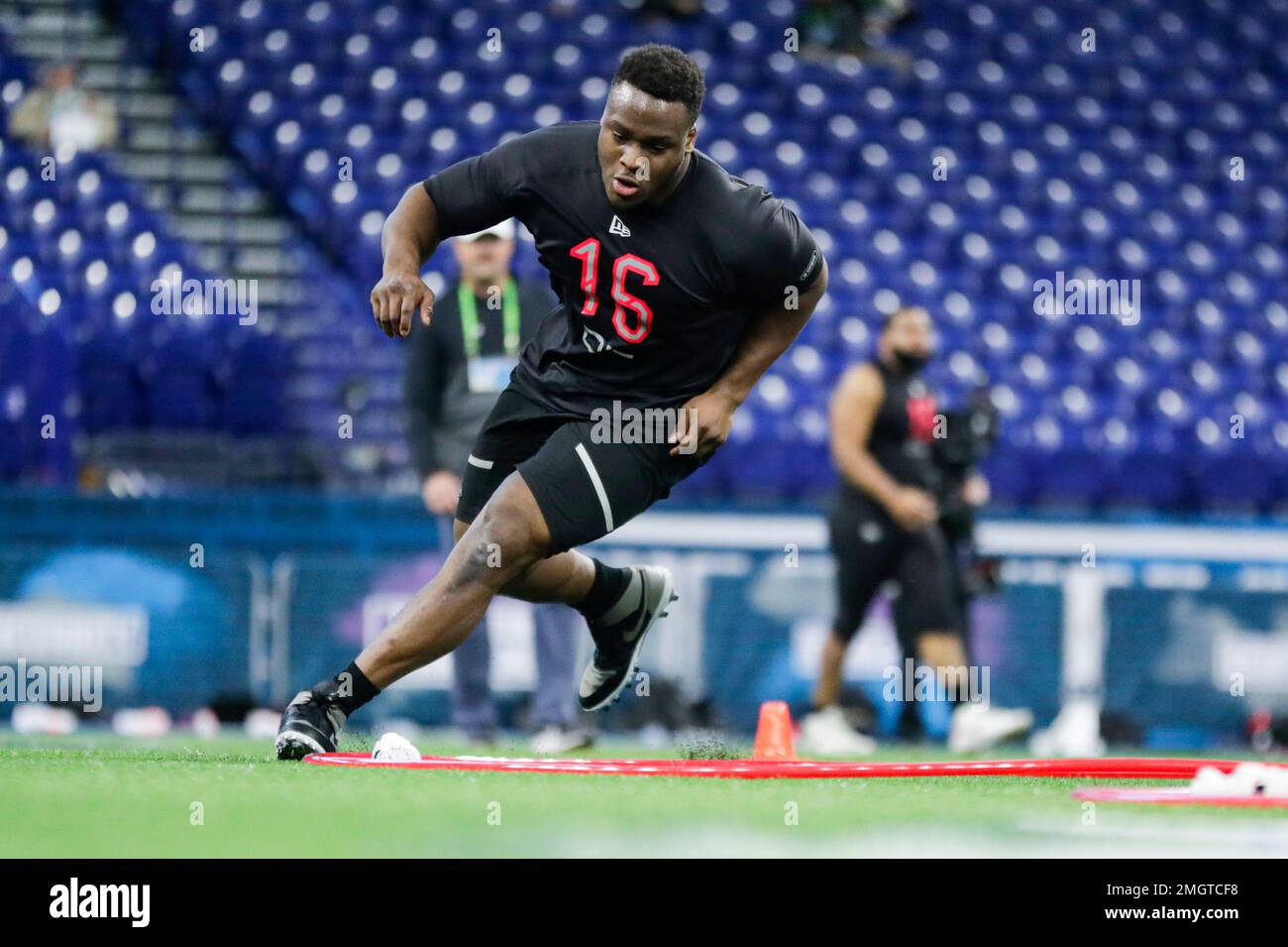 Texas A&M defensive lineman Justin Madubuike runs a drill at the NFL ...