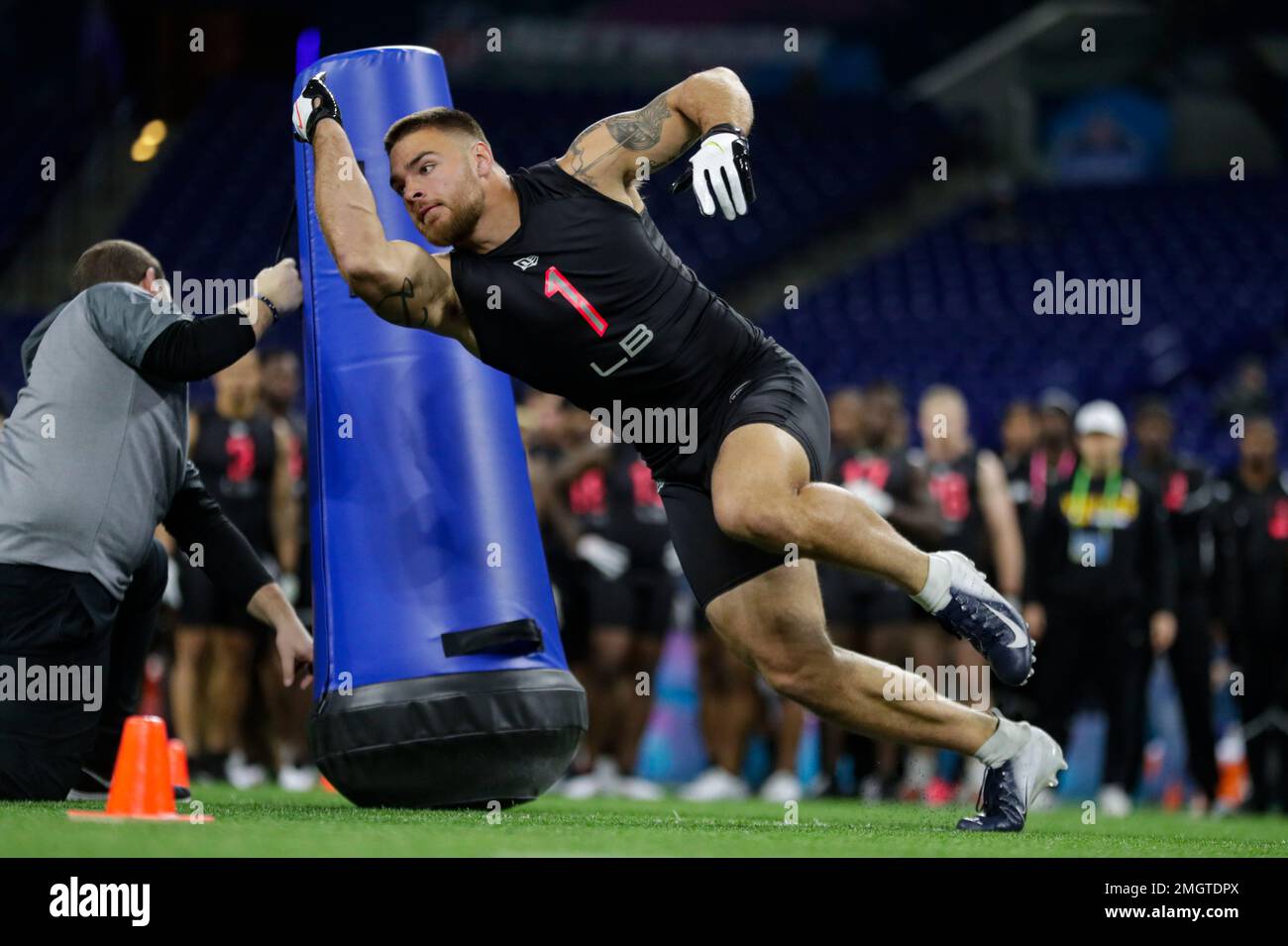 Michigan State linebacker Joe Bachie runs a drill at the NFL football ...
