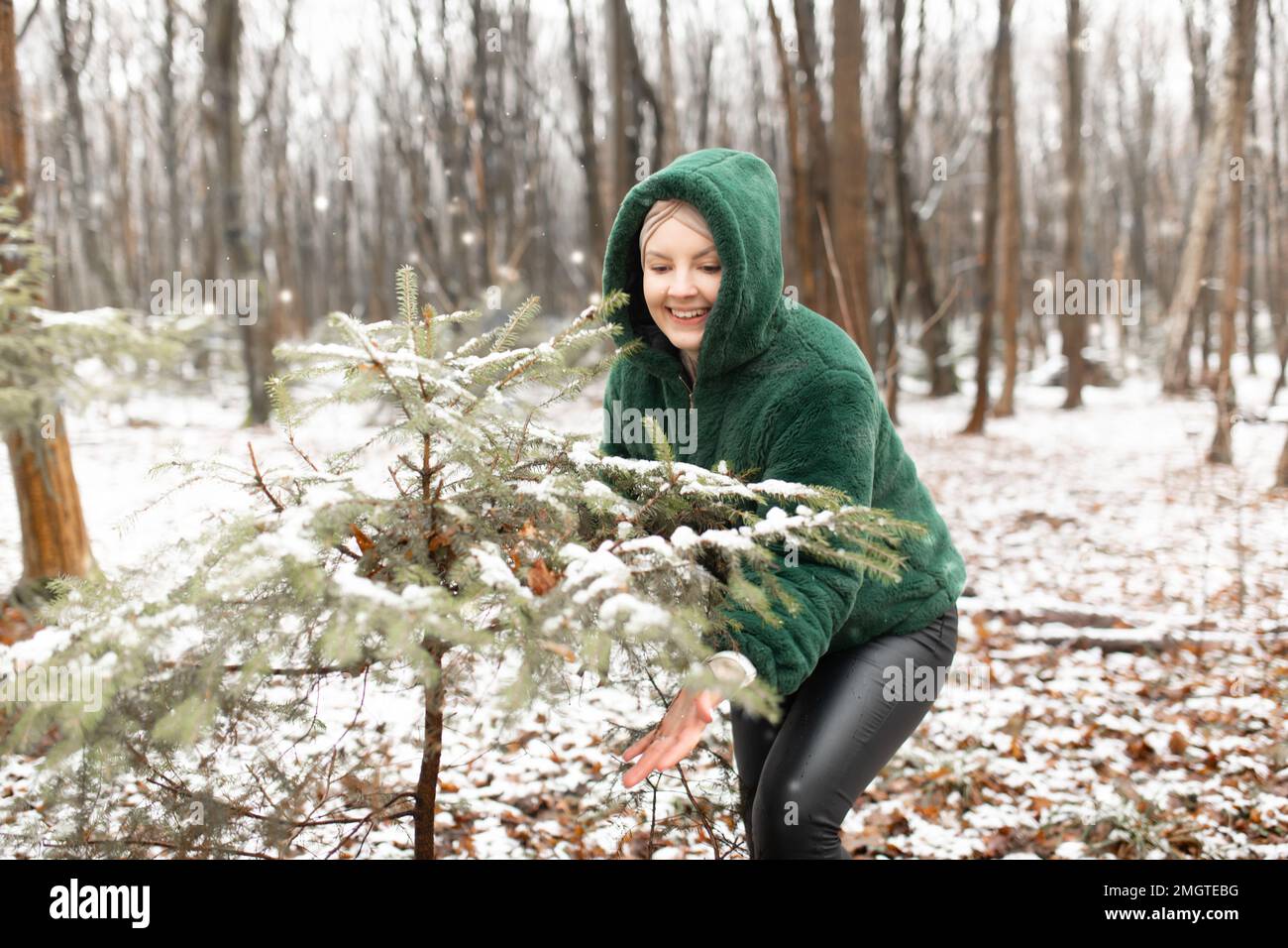 Happy woman in winter forest. Female portrait in snow park. Cheerful ...