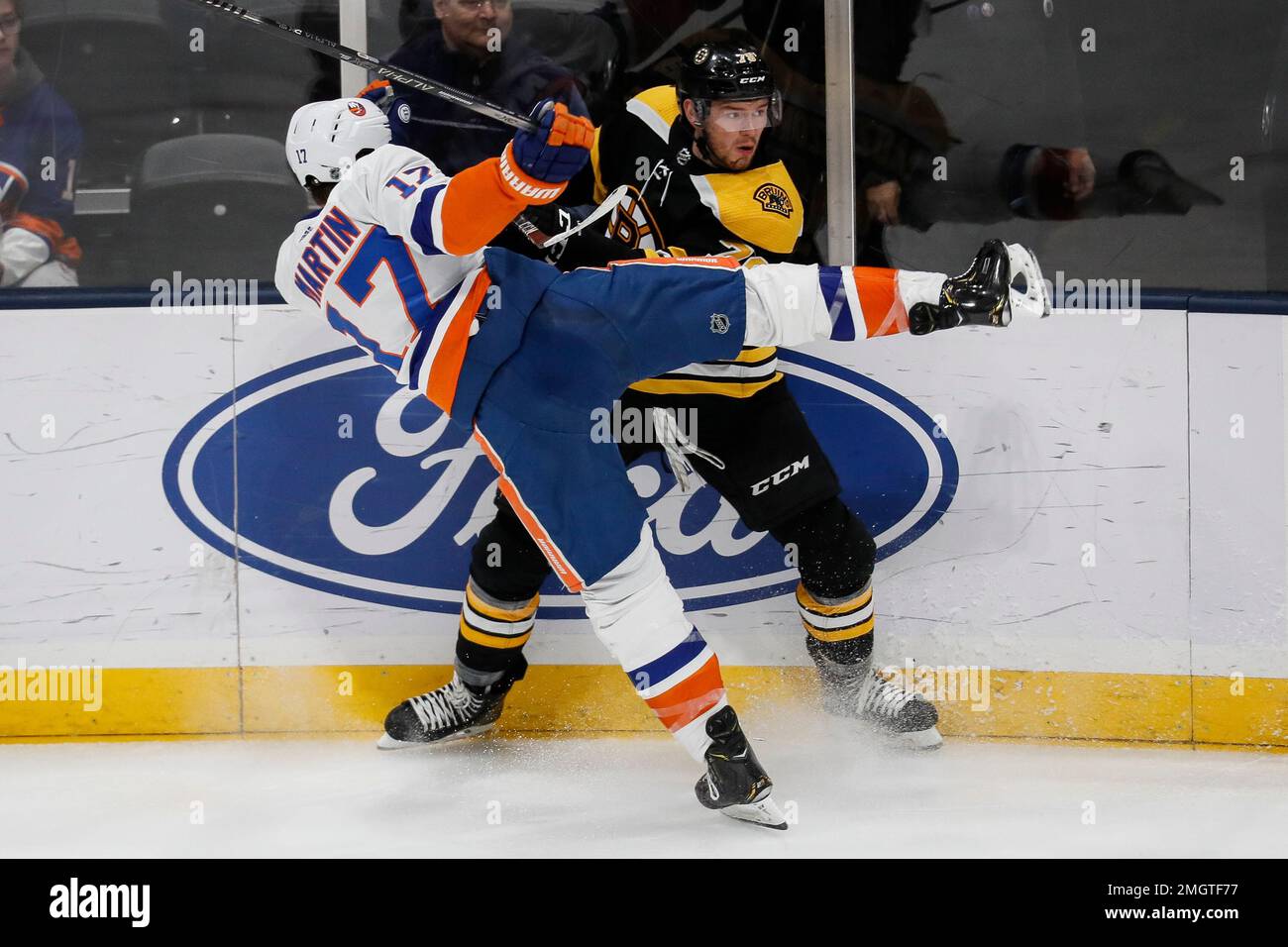 Boston Bruins defenseman Jeremy Lauzon (79) and New York Islanders left ...