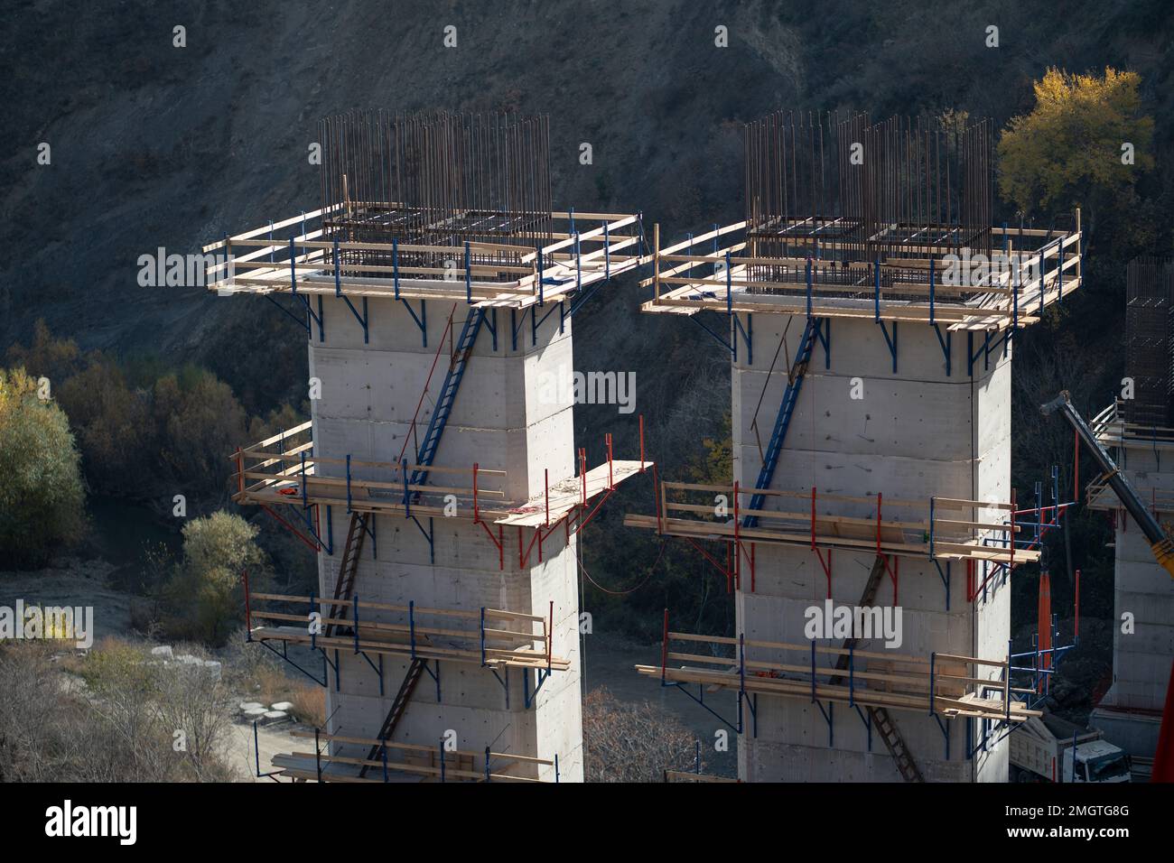 Supports of bridge under construction with wooden scaffolding and ...