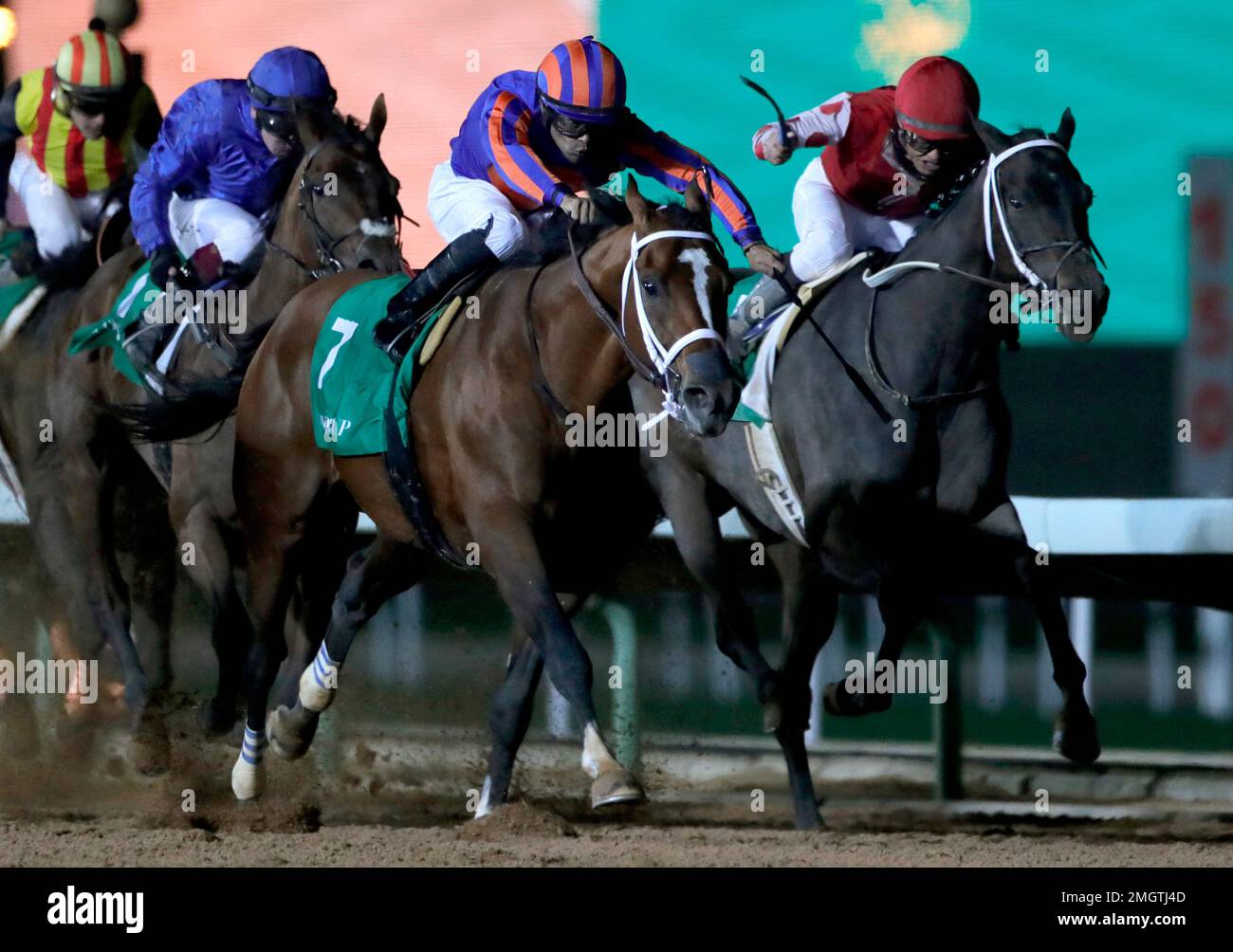 Horses take off after the final race of the $20 million award, the ...