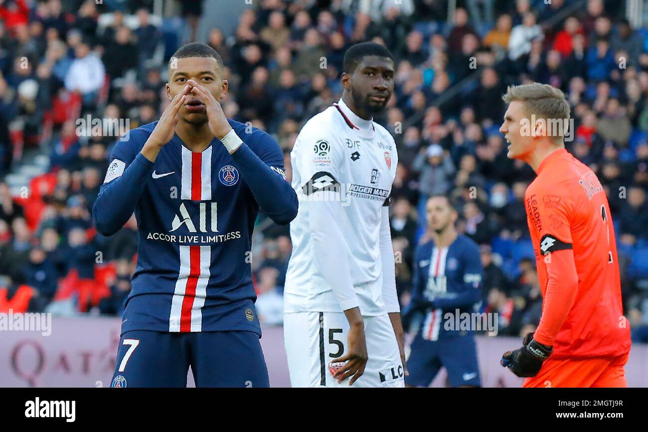 PSG's Kylian Mbappe, left, reacts after missing a scoring chance during ...