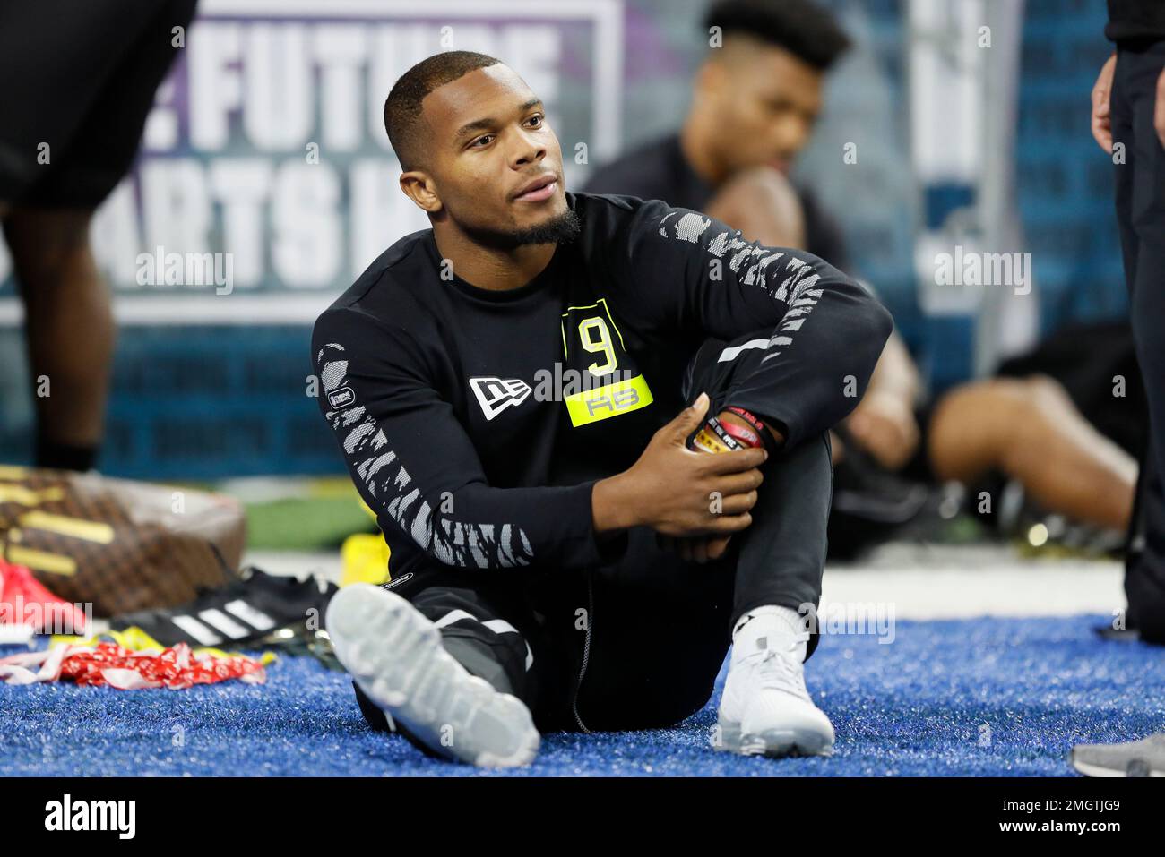 Ohio State running back J K Dobbins watches the 40-yard dash at the NFL ...