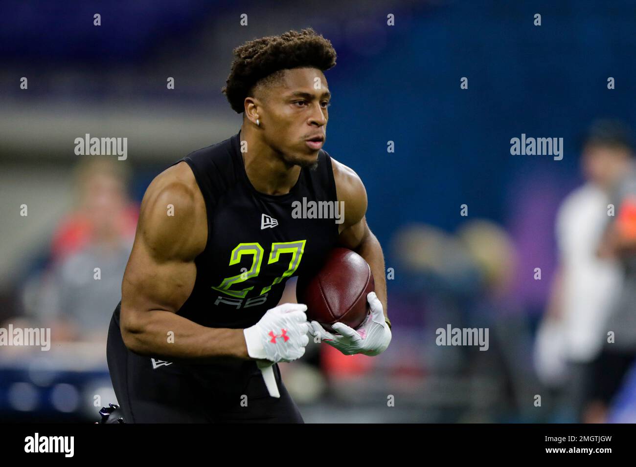 Wisconsin running back Jonathan Taylor runs a drill at the NFL football ...