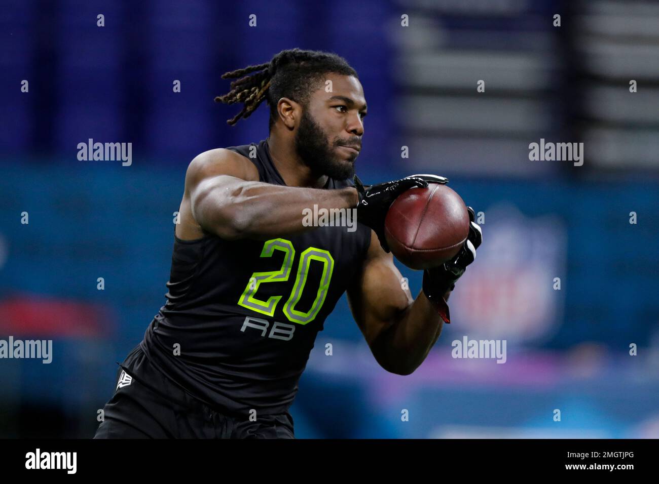Utah running back Zack Moss runs a drill at the NFL football scouting ...