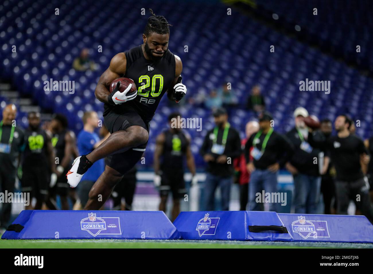 Utah running back Zack Moss runs a drill at the NFL football scouting ...