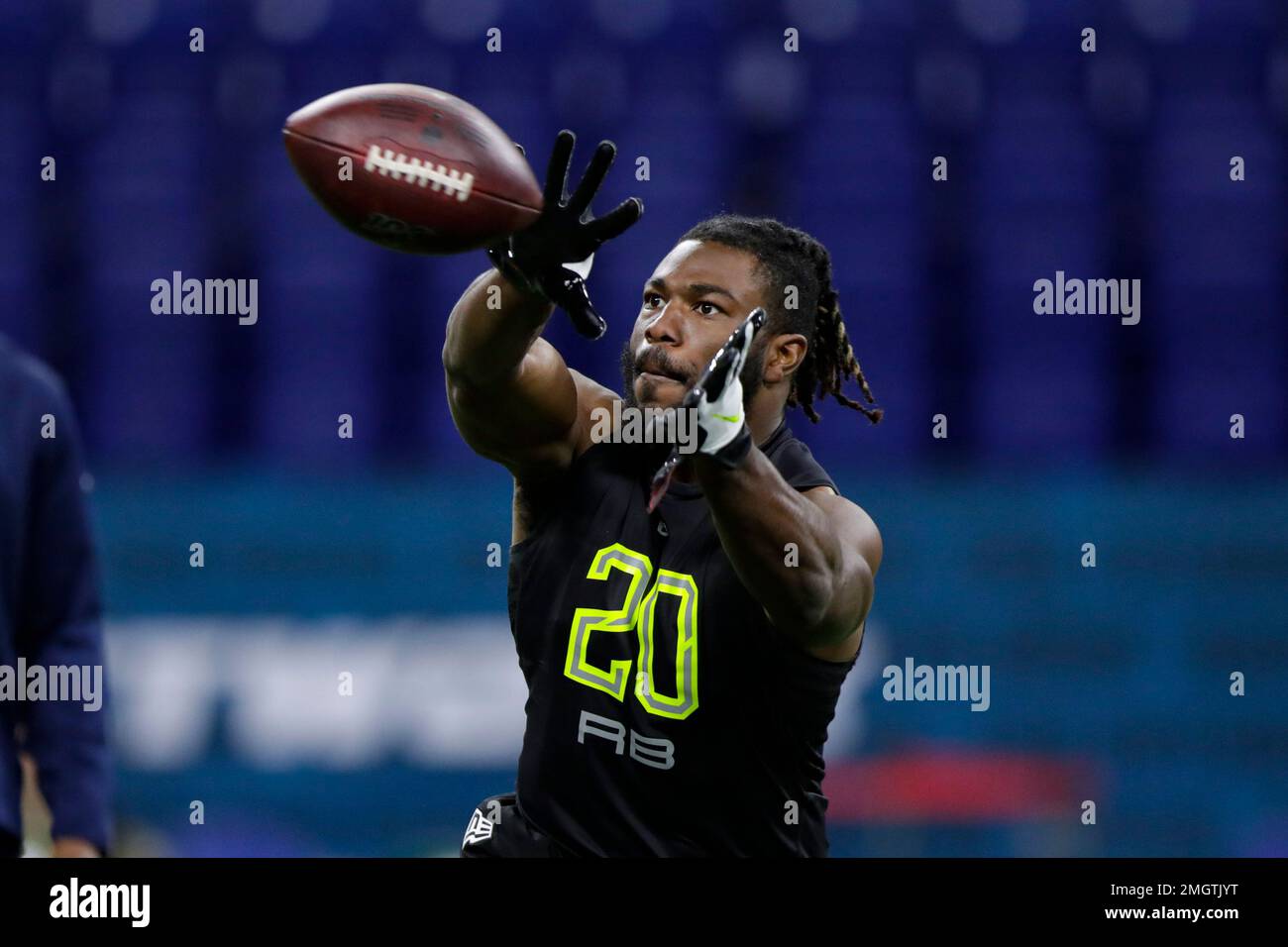 Utah running back Zack Moss runs a drill at the NFL football scouting ...