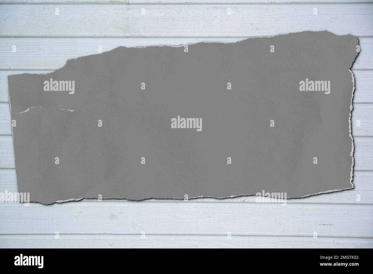 crumpled paper gray sheet on white wooden background Stock Photo - Alamy