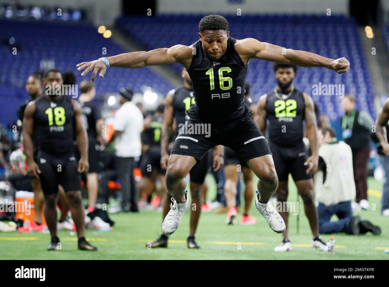 UCLA running back Joshua Kelley runs a drill at the NFL football ...