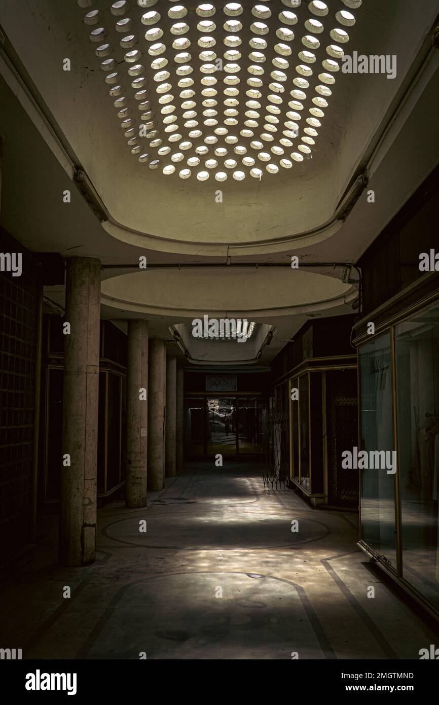 abandoned business building with little light atmospheric space, dark ...