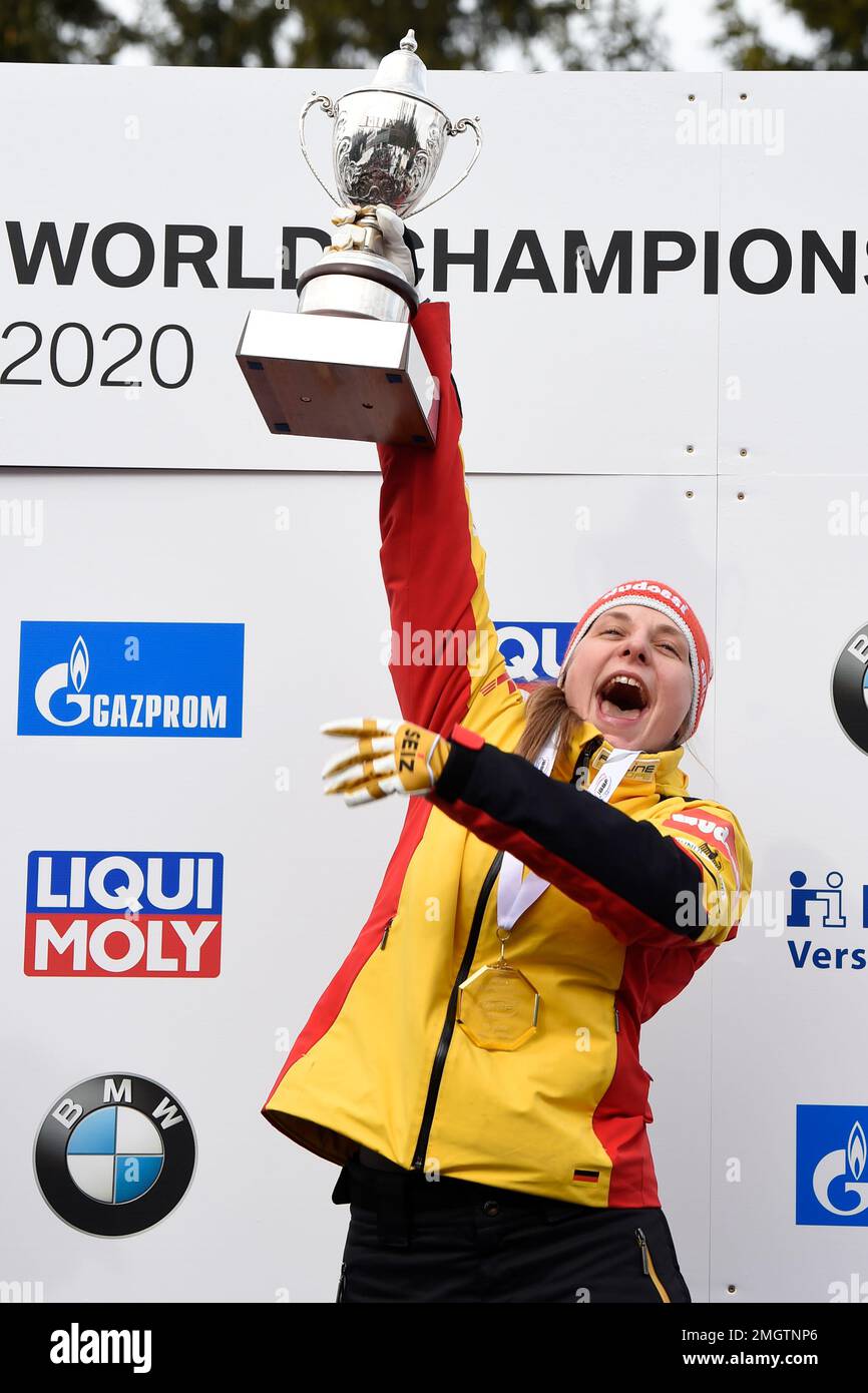 Winner Tina Hermann of Germany lifts the trophy on the podium during ...